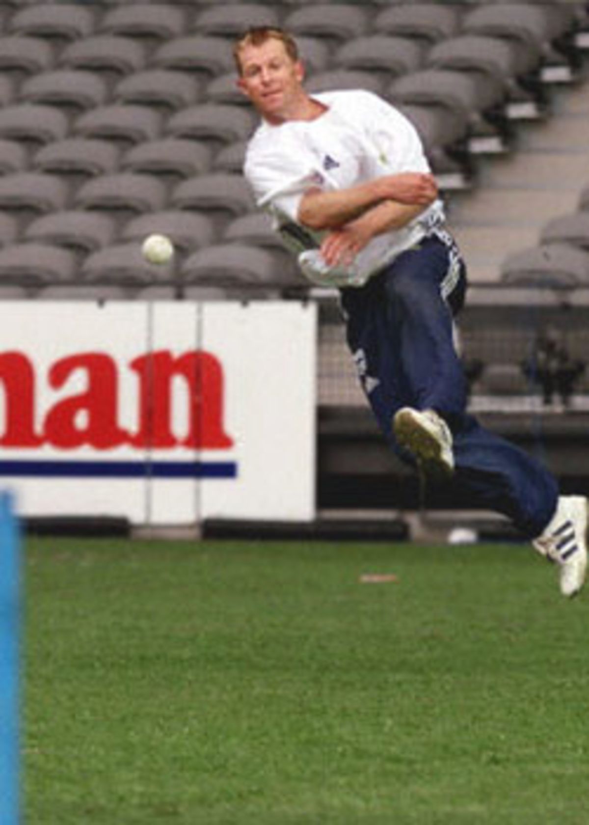 Jonty Rhodes is airborne as he attempt to throw down the stumps during ...