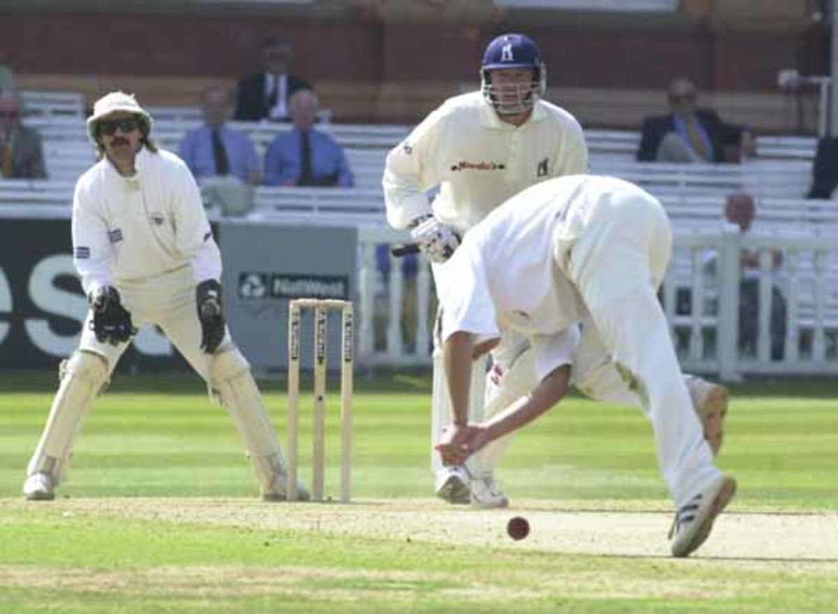 Ed Giddins sweeps the ball up from a stroke by Hancock | ESPNcricinfo.com