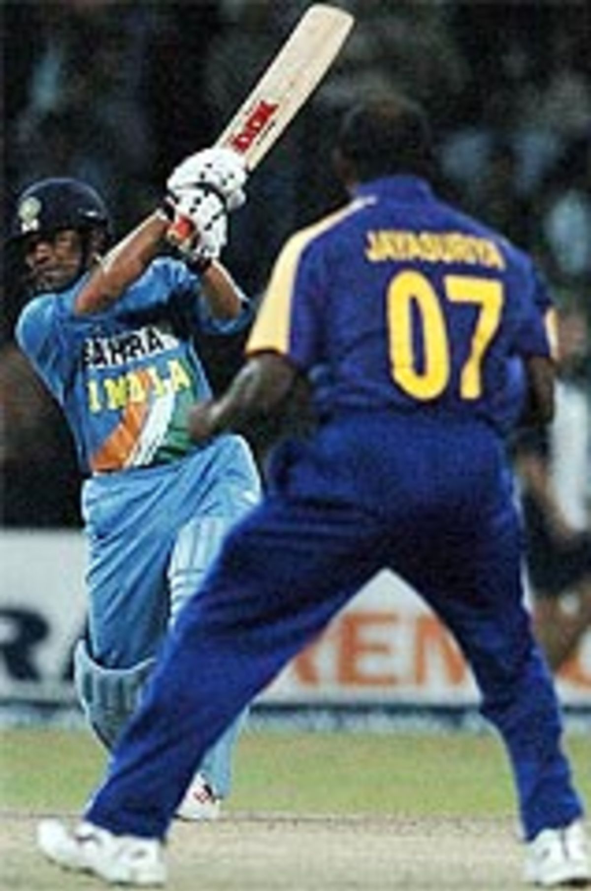 Sachin Tendulkar drives as Sanath Jayasuriya looks on | ESPNcricinfo.com