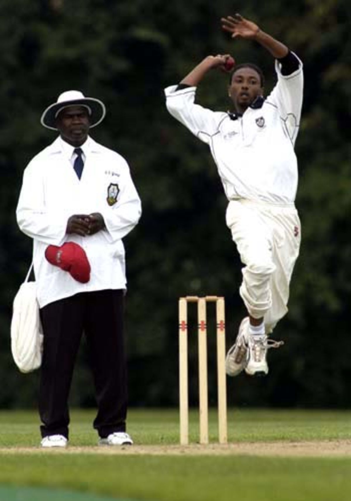 Kevin Sandher (with cap in the centre) smiles after capturing his sixth ...