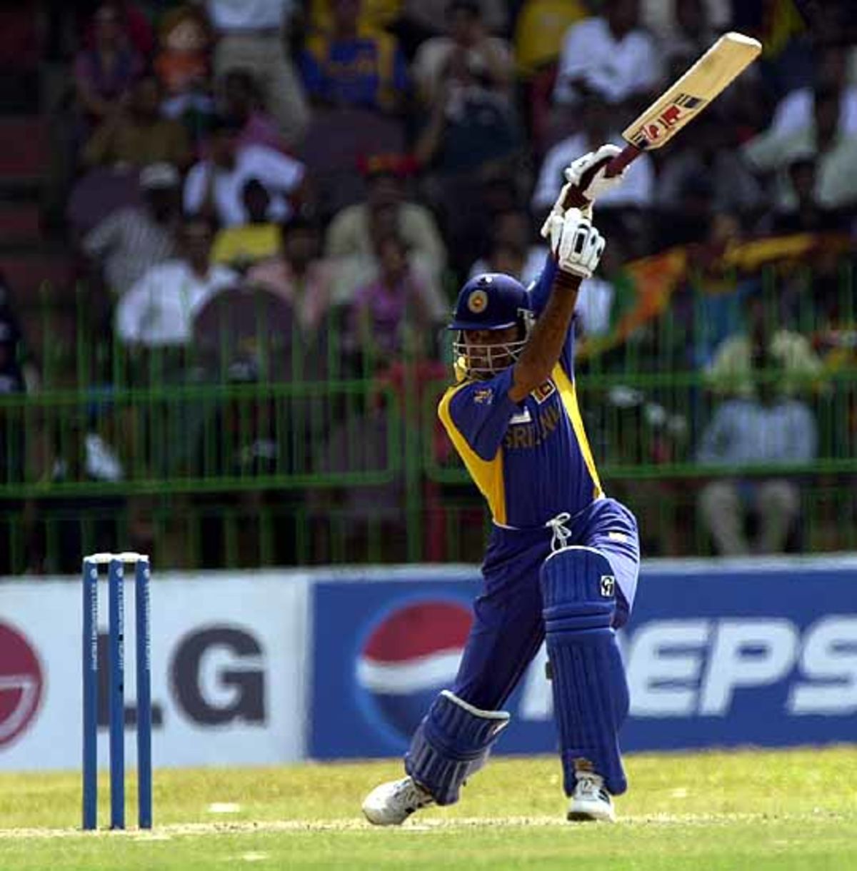 Russel Arnold mis-times a sweep as the light fades | ESPNcricinfo.com