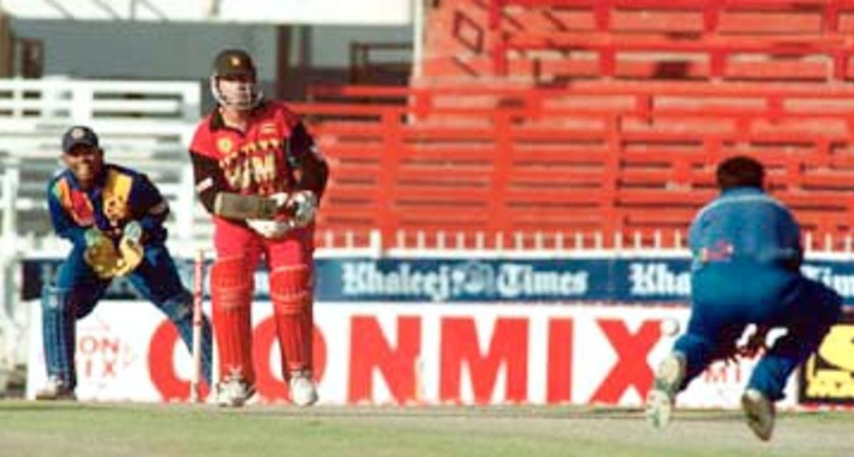 Muralitharan about to take a return catch from Guy Whittall ...