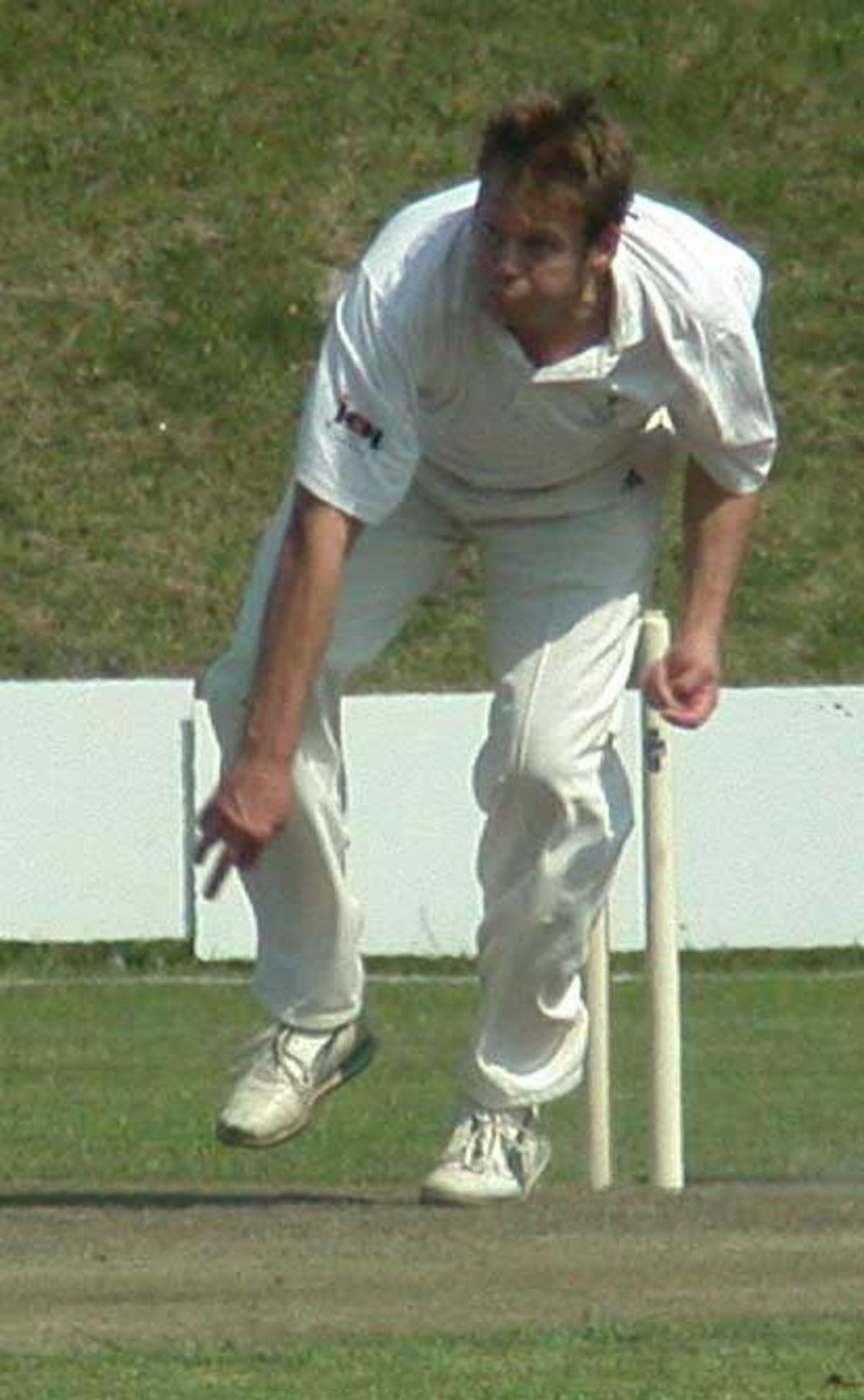 Arthur Moore puuting effort into one of his deliveries against ...