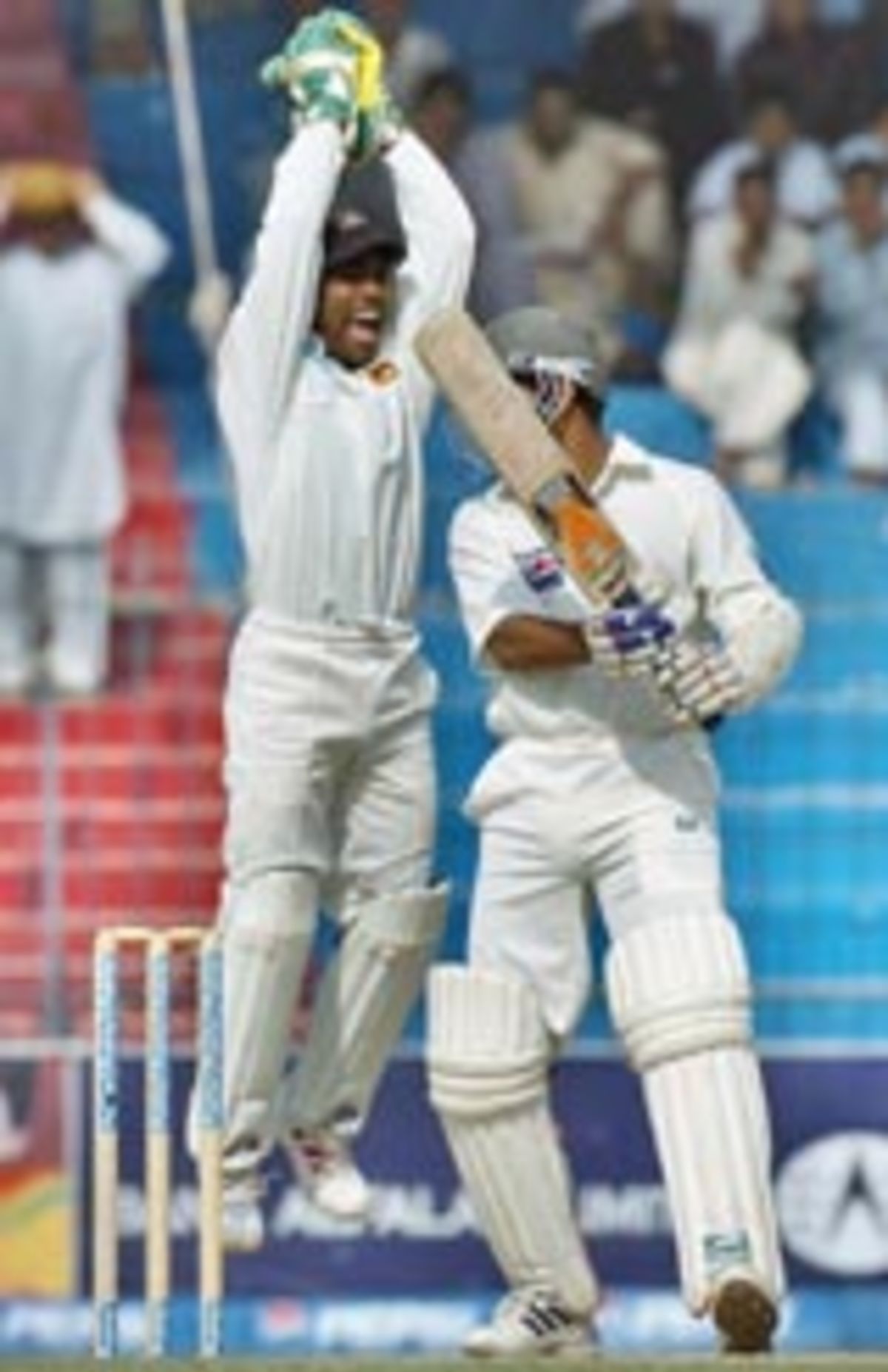 Romesh Kaluwitharana celebrates as Yousuf Youhana is caught behind ...