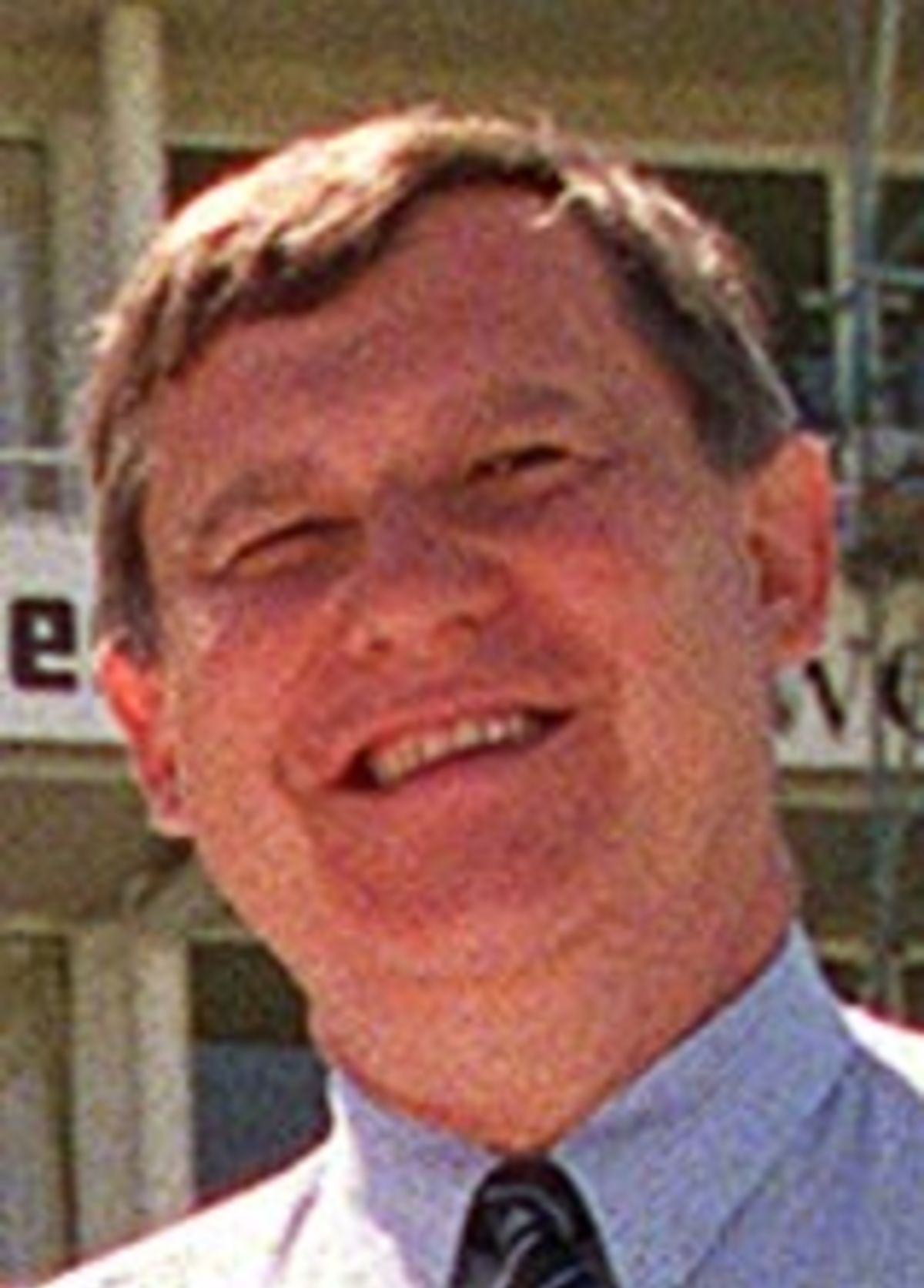 A lone spectator wraps up against the cold and the wet | ESPNcricinfo.com