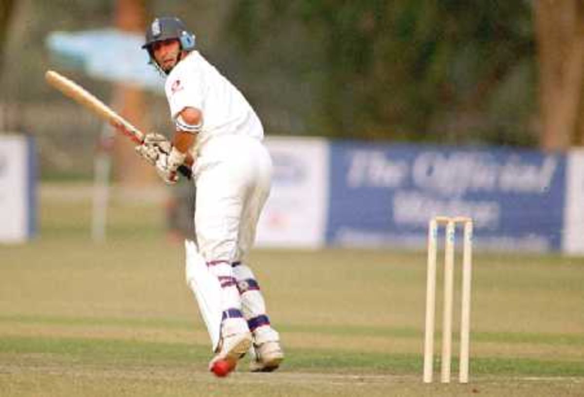 Nasser Hussain following the ball as he flicks it towards fine leg ...