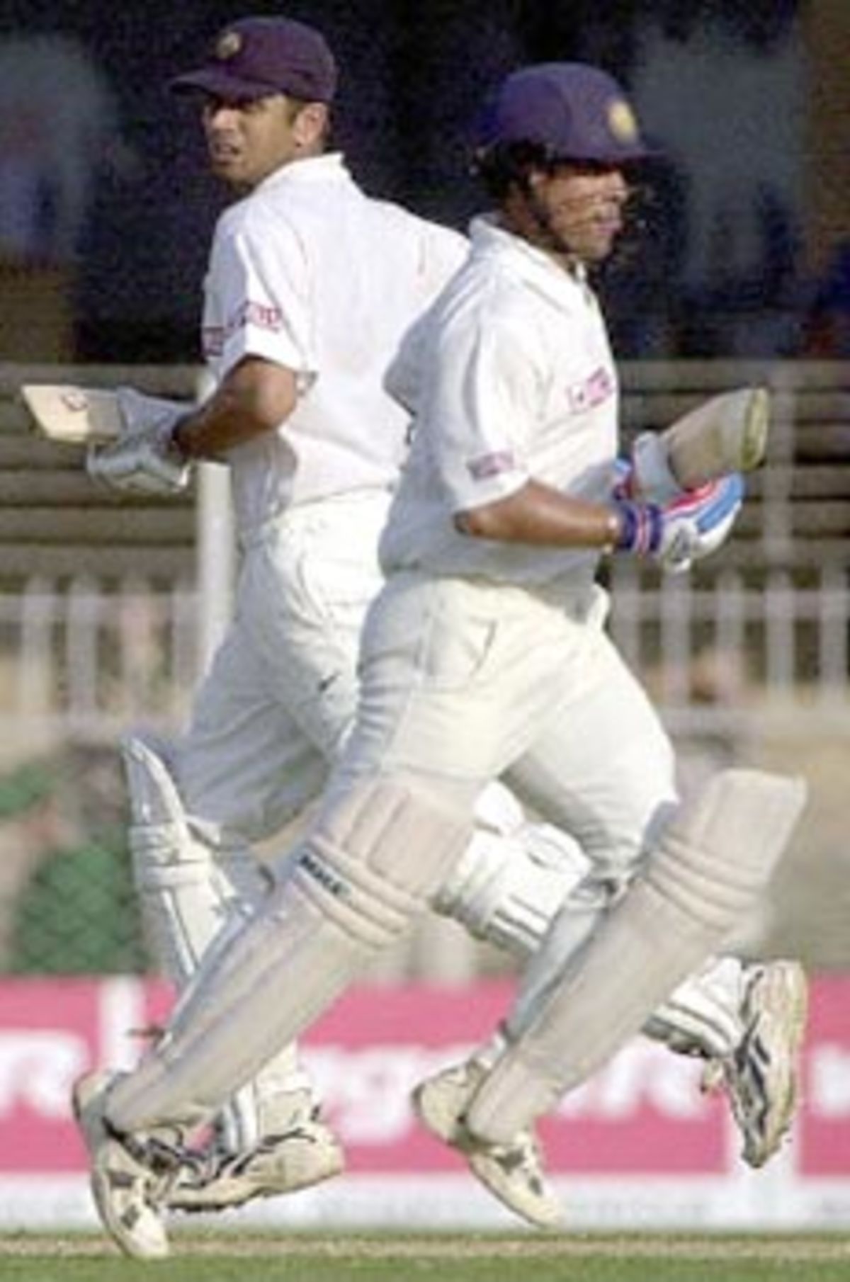 Dravid looks over his shoulder as he crosses over for a single ...