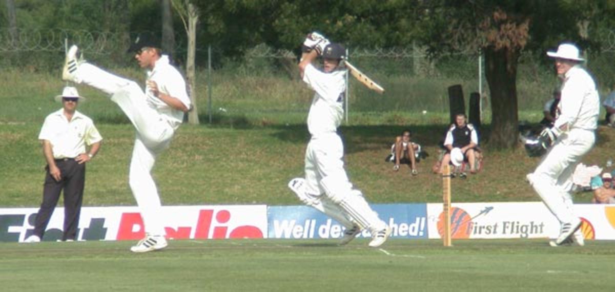 WP opening batsman Andrew Puttick drives a ball through the covers ...