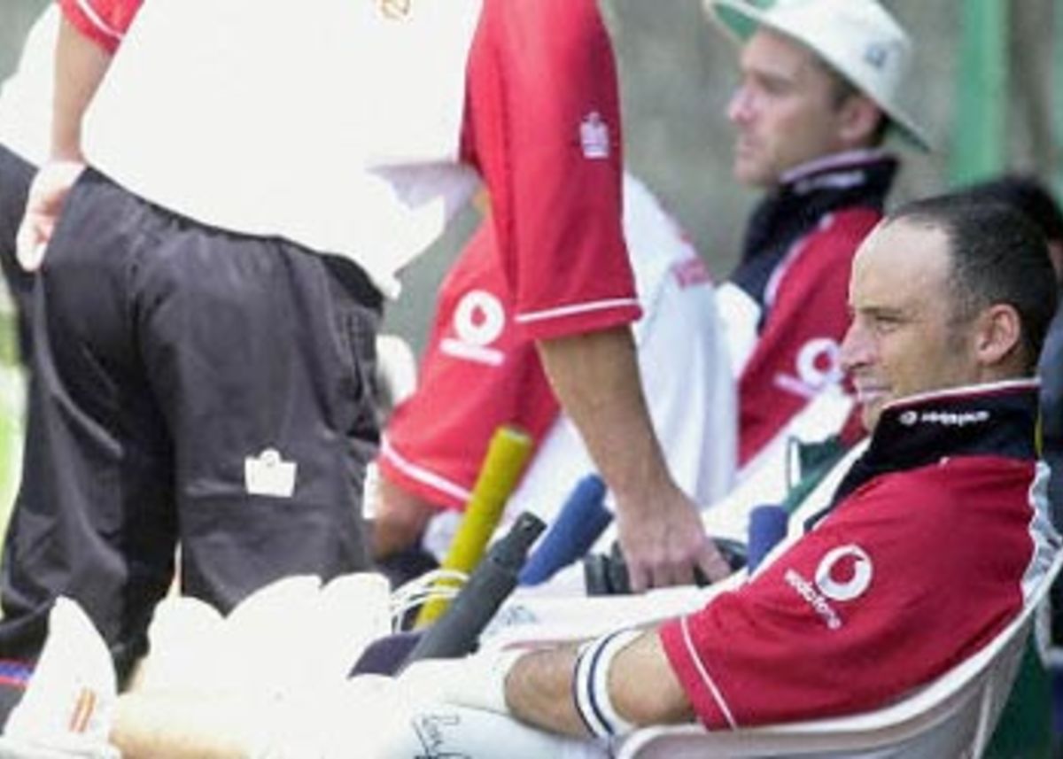 Martyn Ball checks out how hopeful stumper Warren Hegg gathers the ball ...