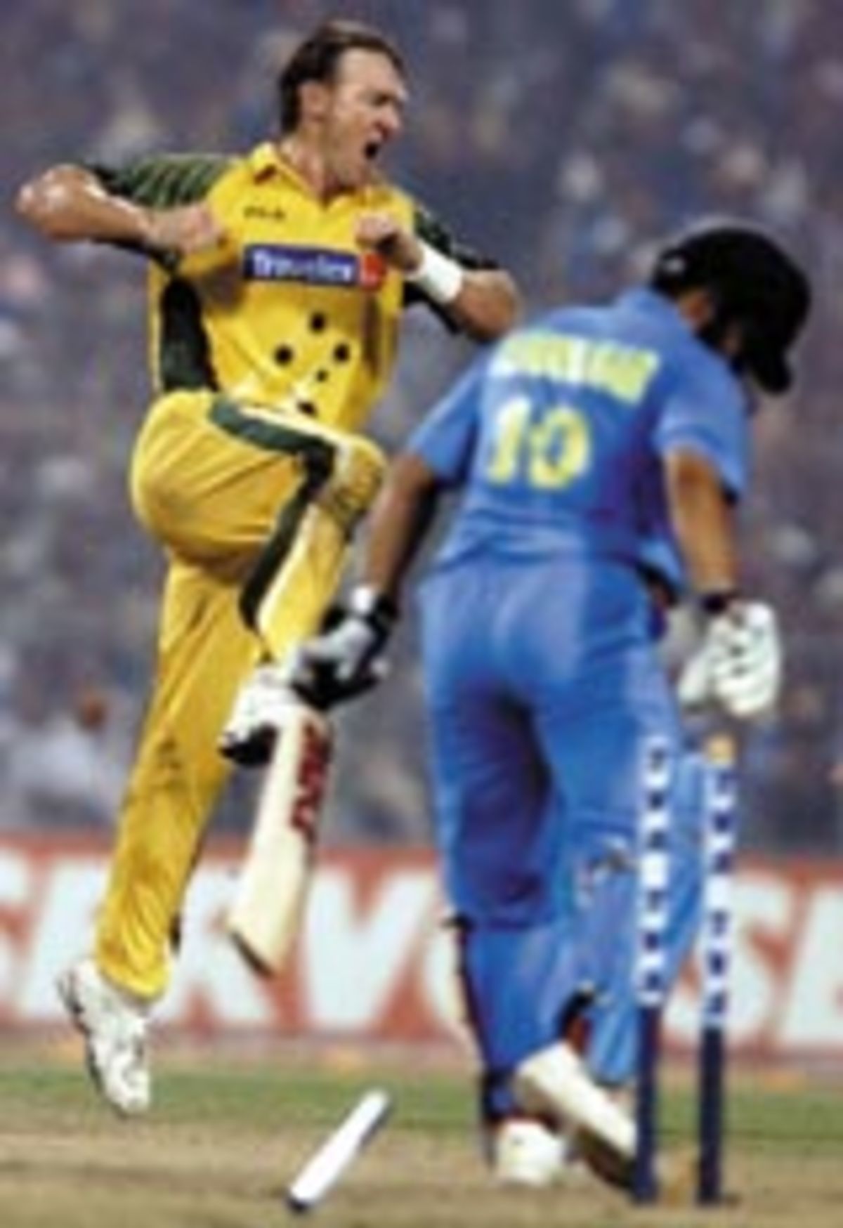 Andy Bichel celebrates after clean bowling Sachin Tendulkar ...
