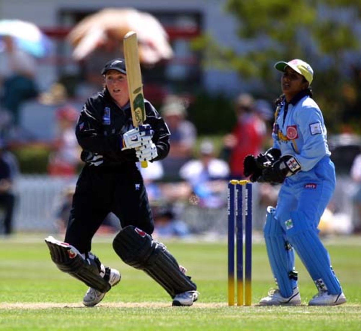 Anna O'Leary dives to the crease as Indian wicketkeeper Anju Jain ...