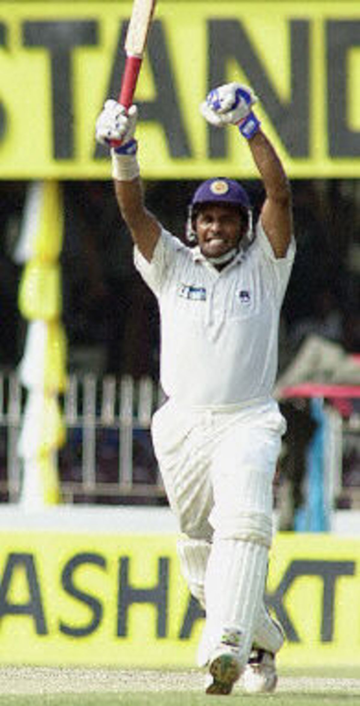 Hashan Tillakaratne celebrates as he completes his century with partner ...