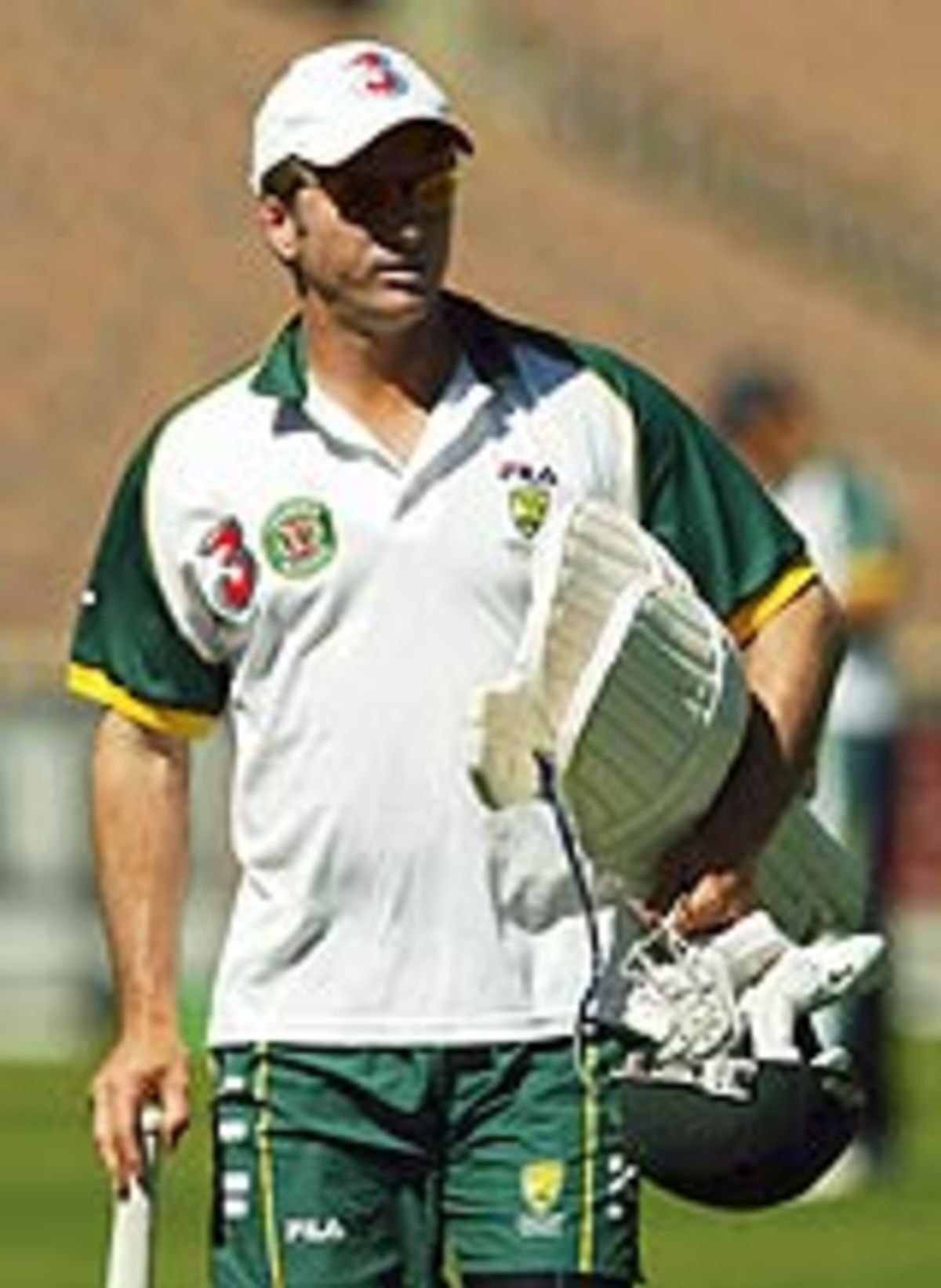 Damien Martyn dives during fielding practice as Adam Gilchrist looks on ...