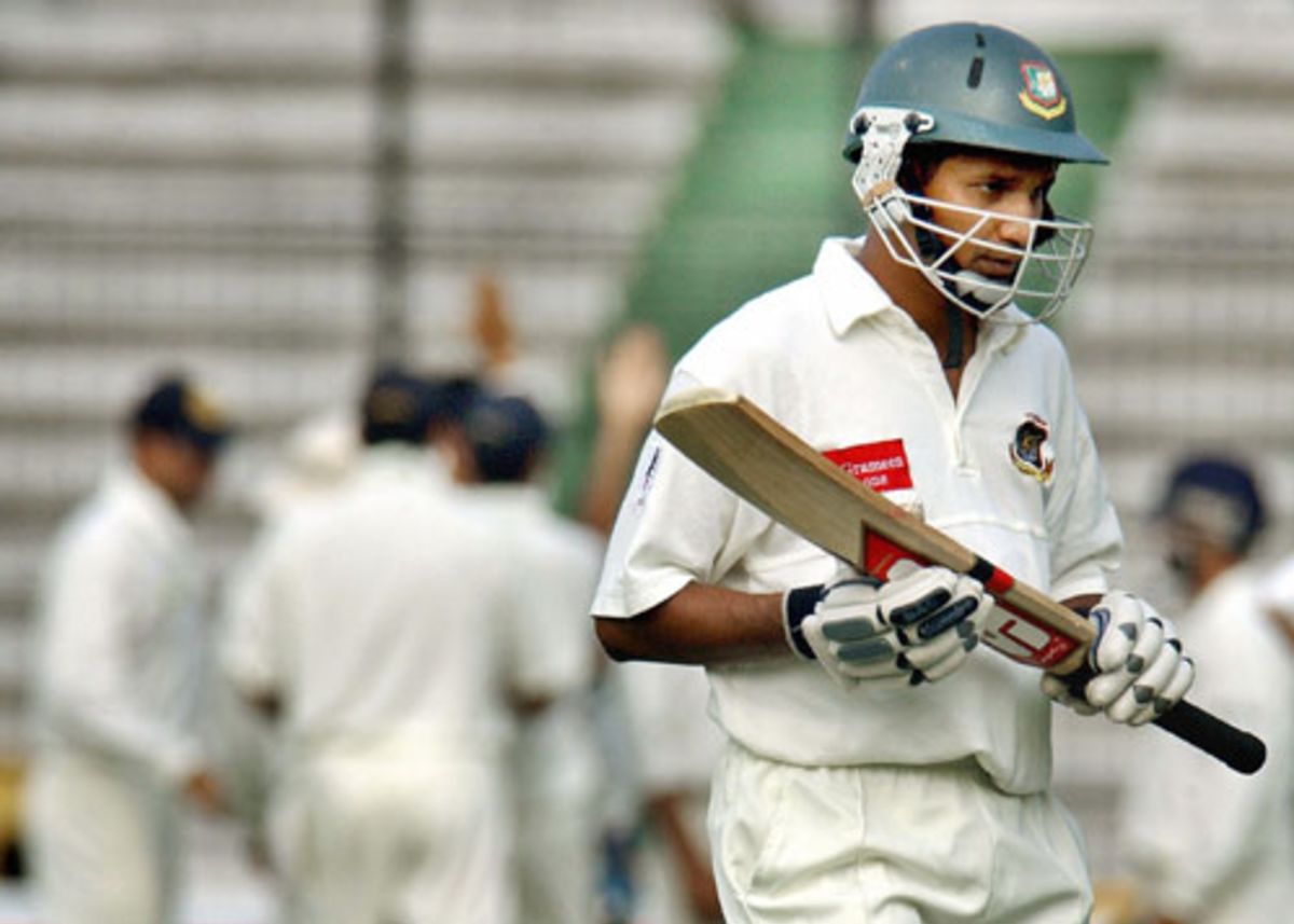 Habibul Bashar walks away as the Indian team celebrates | ESPNcricinfo.com