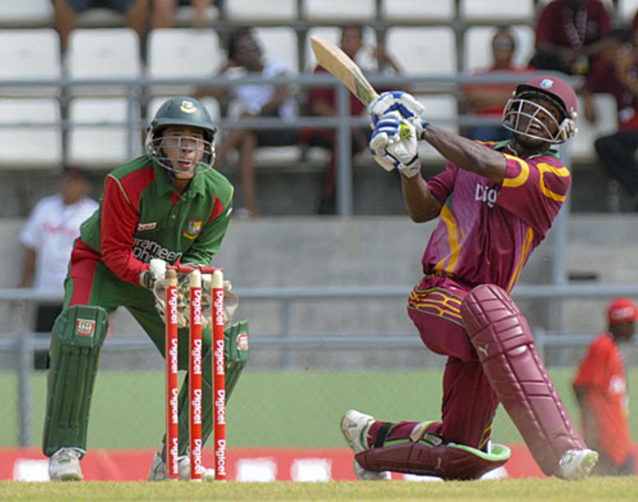 Devon Smith raises the bat after reaching a half-century | ESPNcricinfo.com