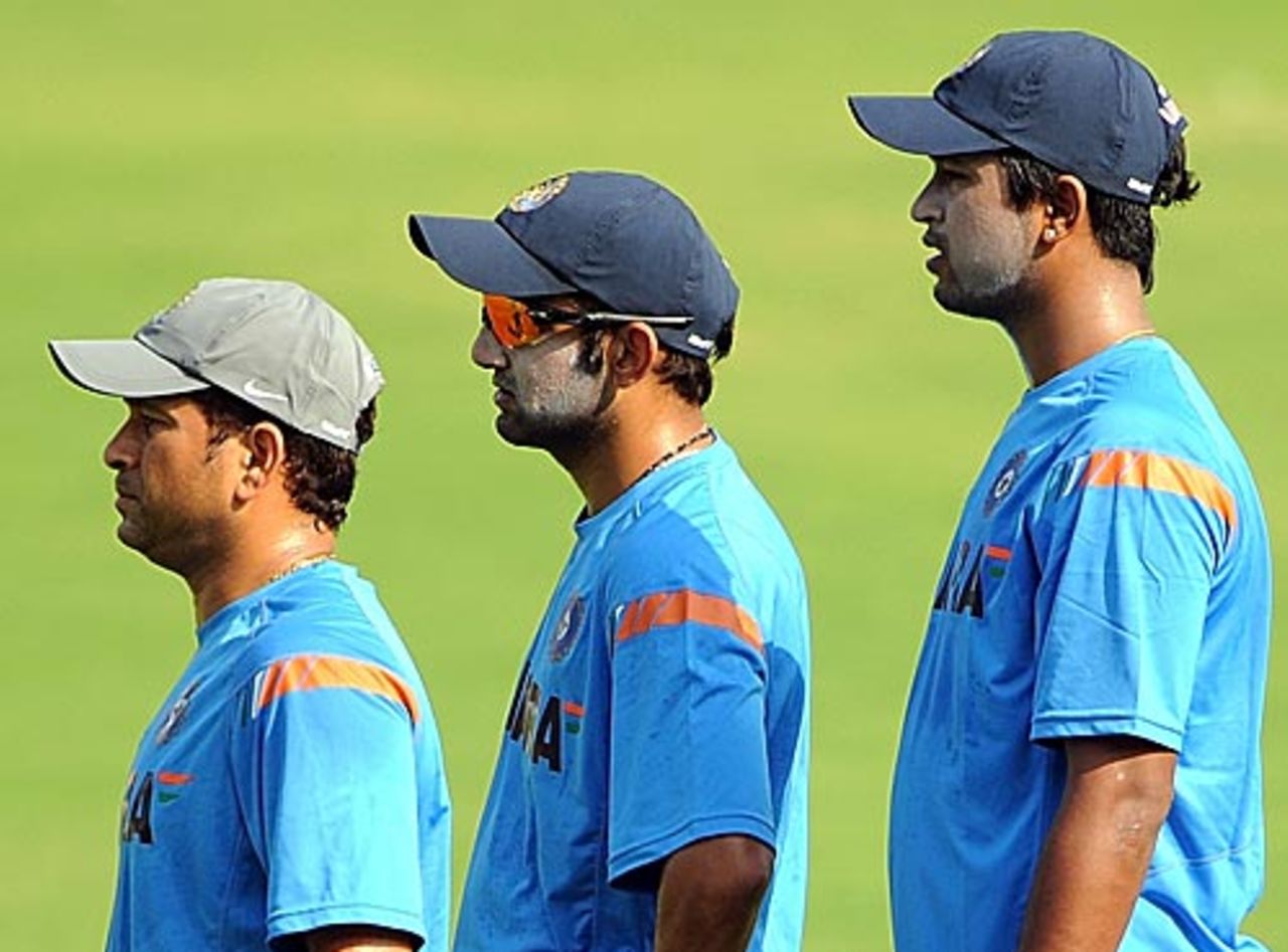 Sachin Tendulkar, Gautam Gambhir and Pragyan Ojha look on during a ...