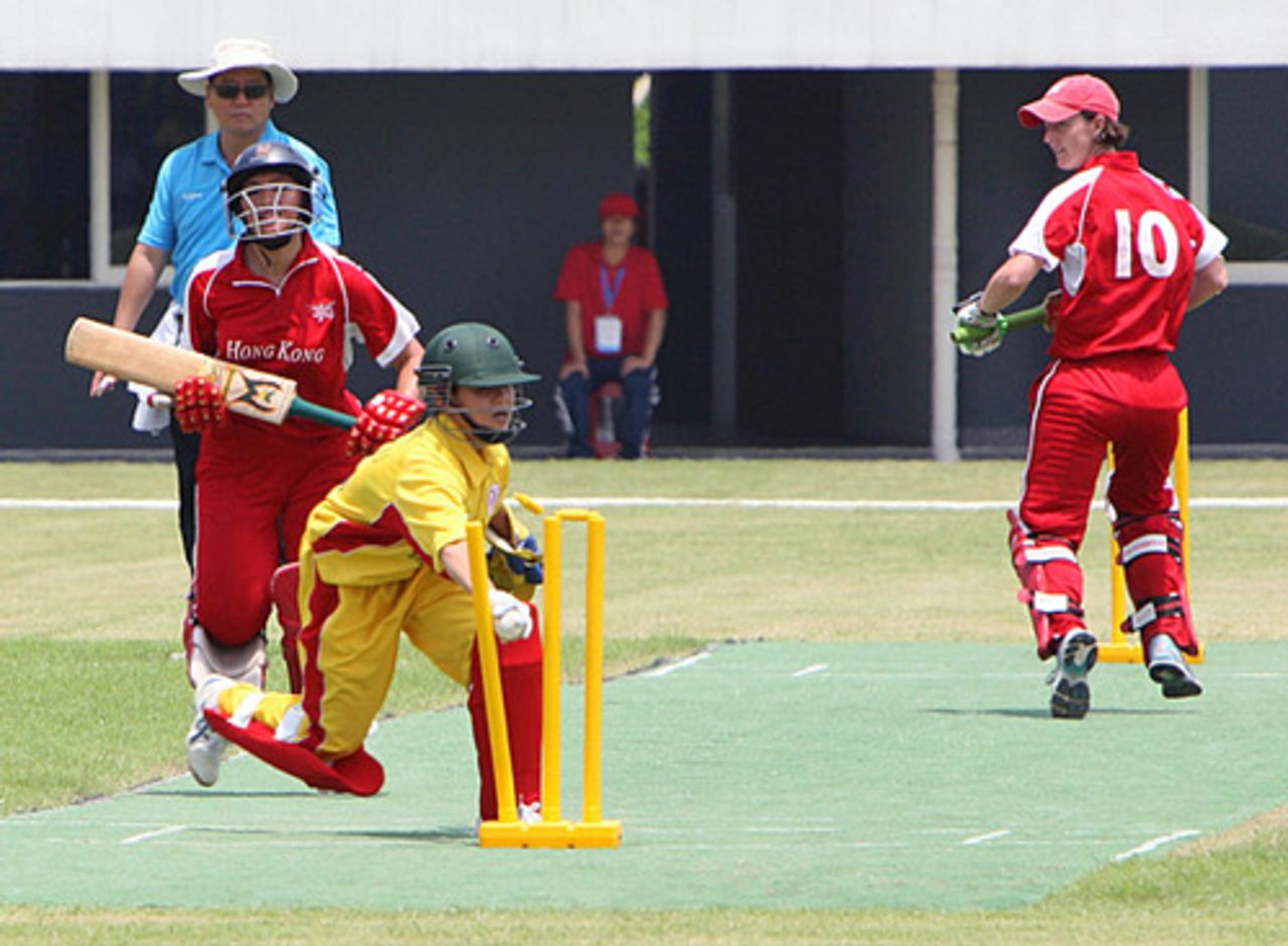 Hong Kong Women's Dominique McCusker is run out in the match against ...