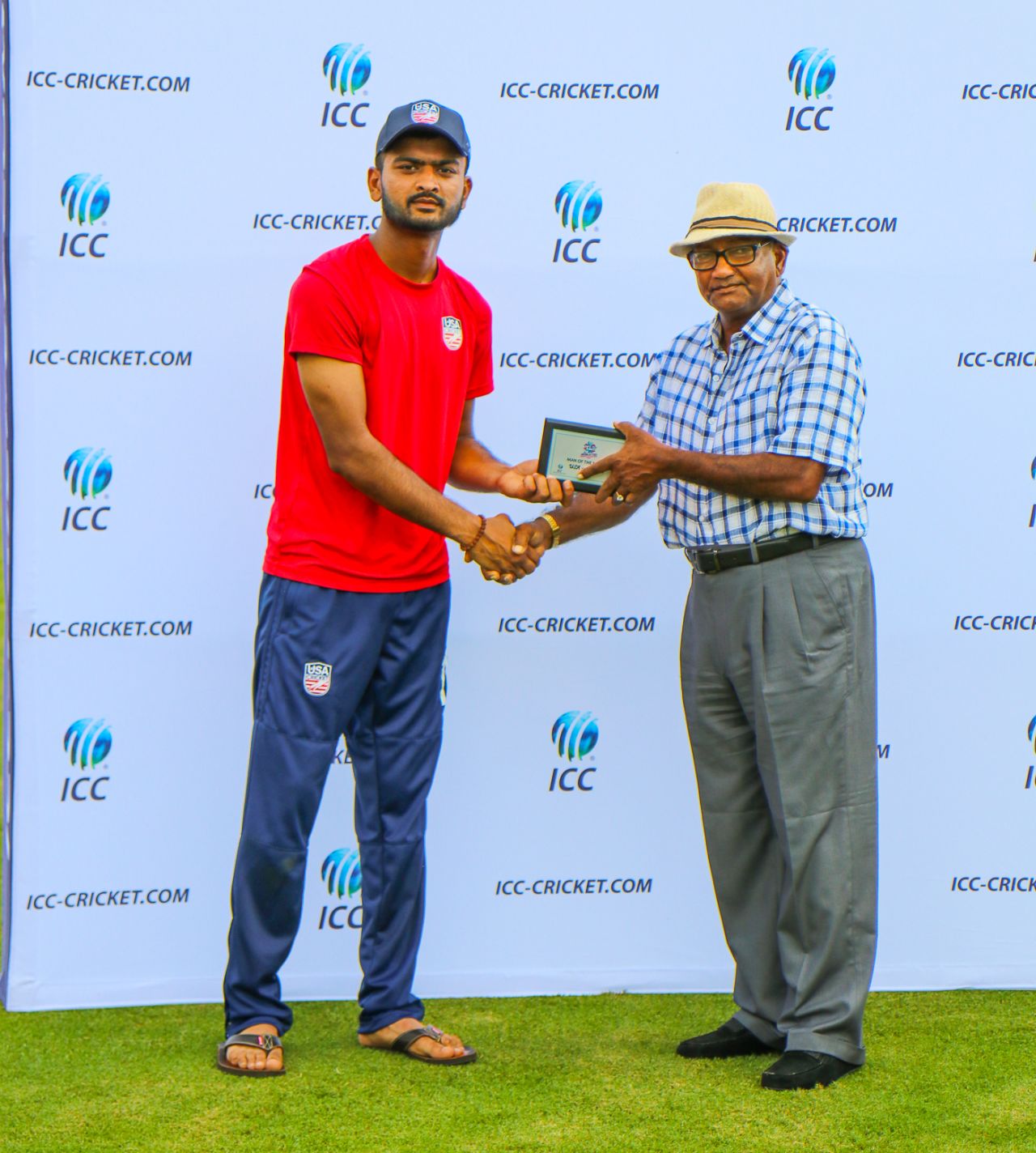 Monank Patel accepts the Man of the Match award from former West Indies ...