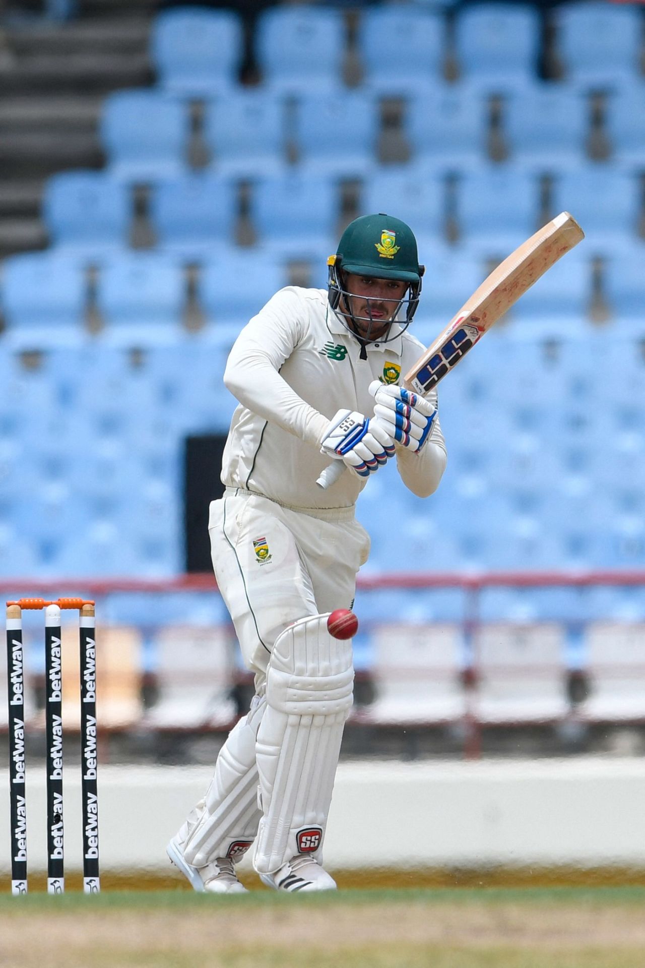 Quinton de Kock gestures to the dressing room on reaching his century ...