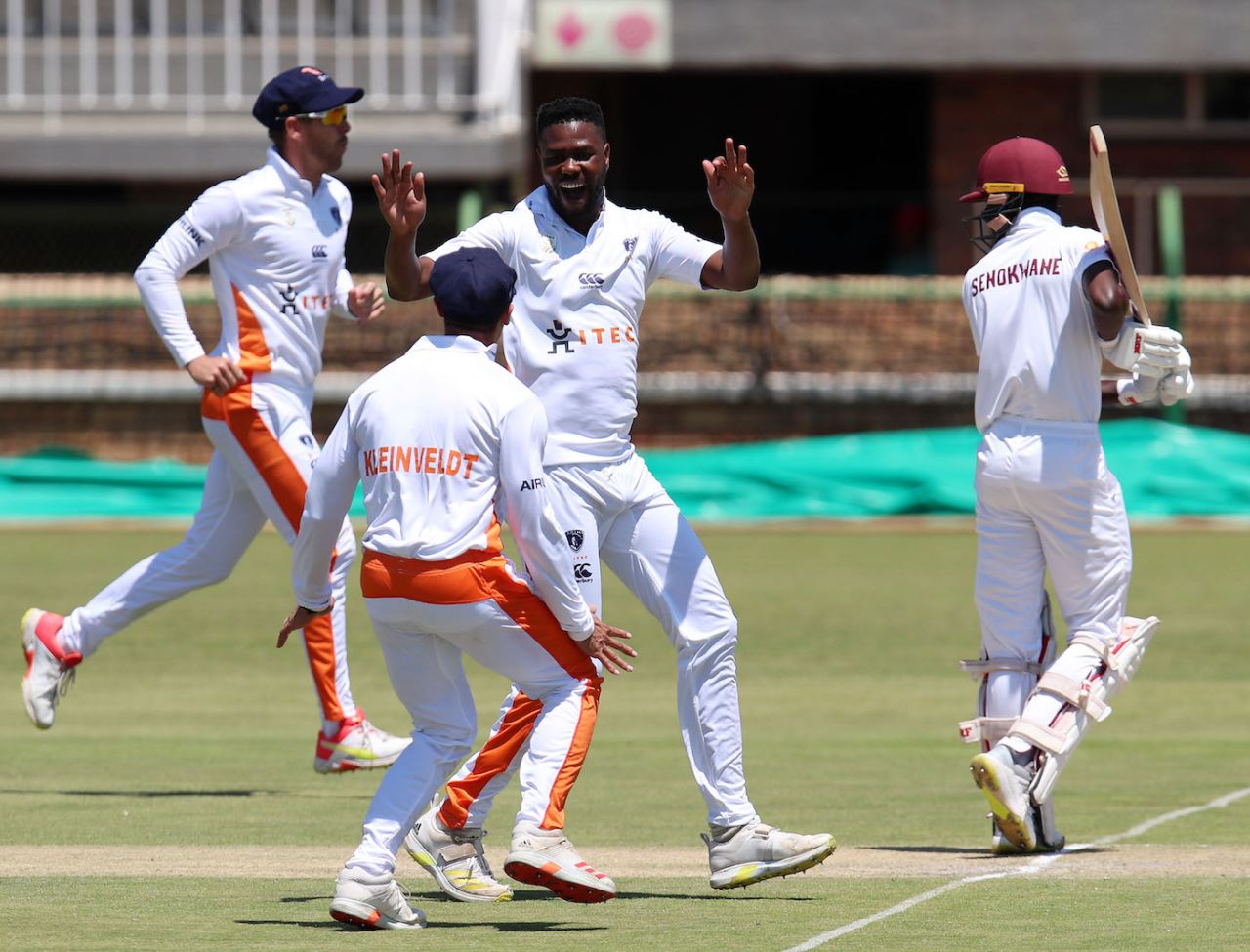Mbulelo Budaza celebrates with Matthew Kleinveldt the wicket of Lesogo ...