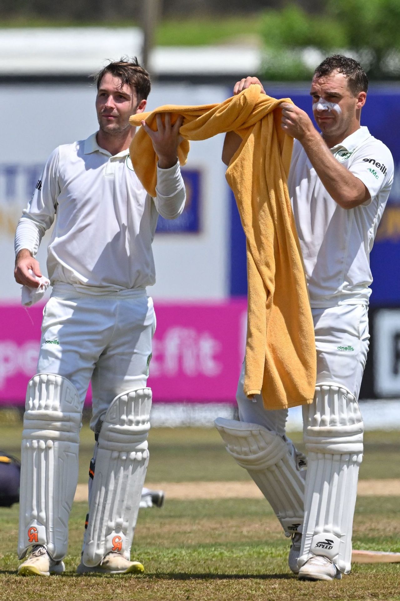 Andy McBrine congratulates Curtis Campher, who brought up his maiden ...
