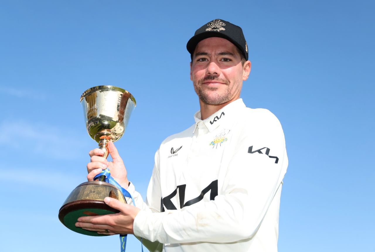 Surrey and their supporters pose with the County Championship trophy ...