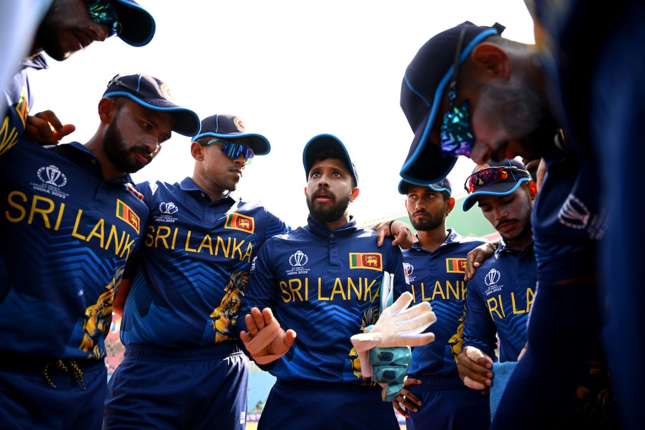 Kasun Rajitha and his team-mates get together after an early wicket ...