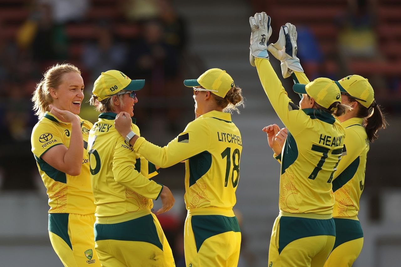 Kim Garth is congratulated by her team-mates after she got rid of the ...