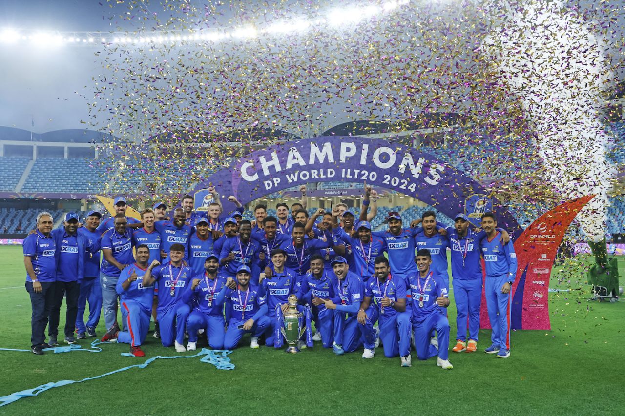 Trent Boult and Dwayne Bravo lift the ILT20 trophy | ESPNcricinfo.com