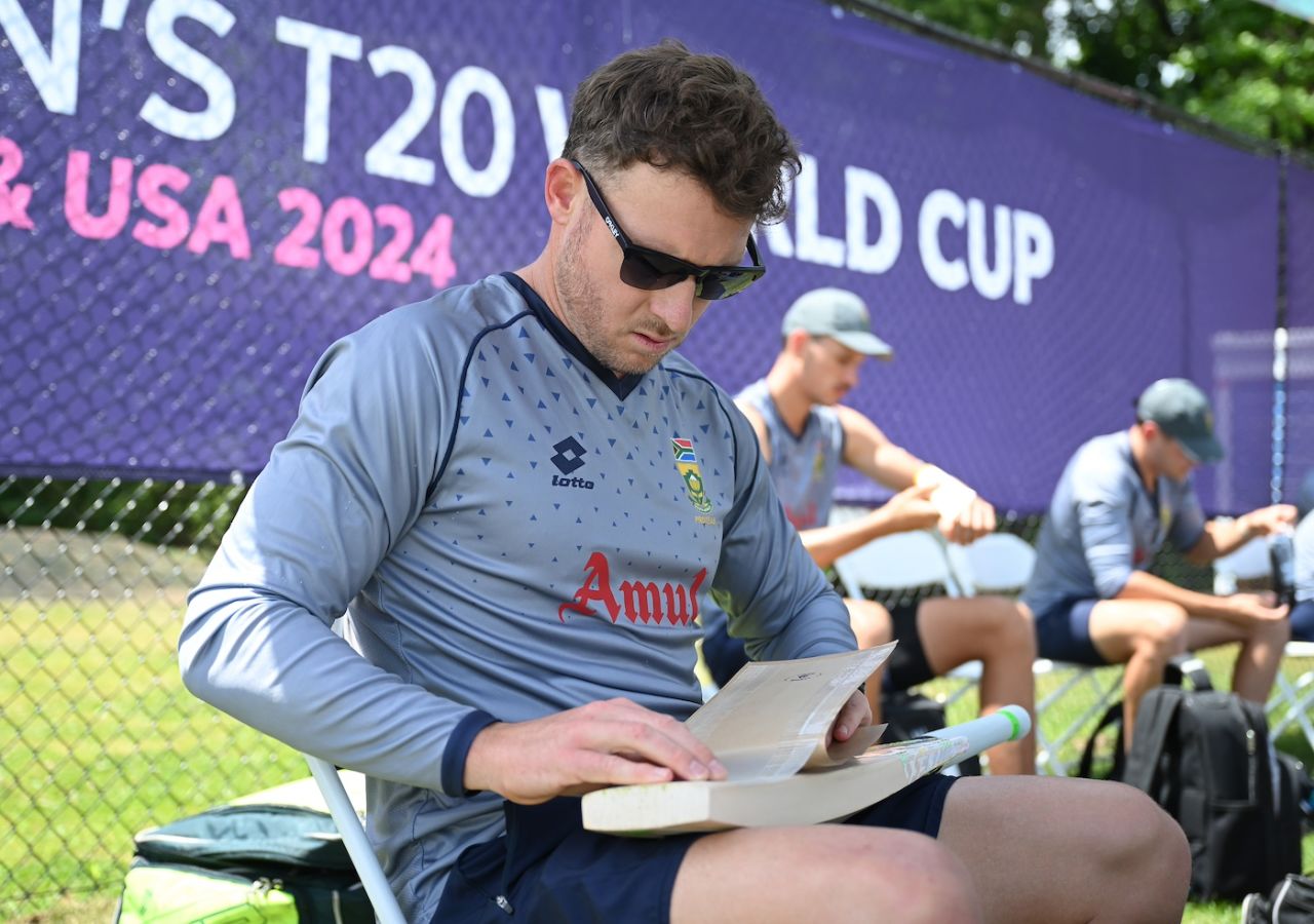 David Miller works on his bat on the sidelines | ESPNcricinfo.com