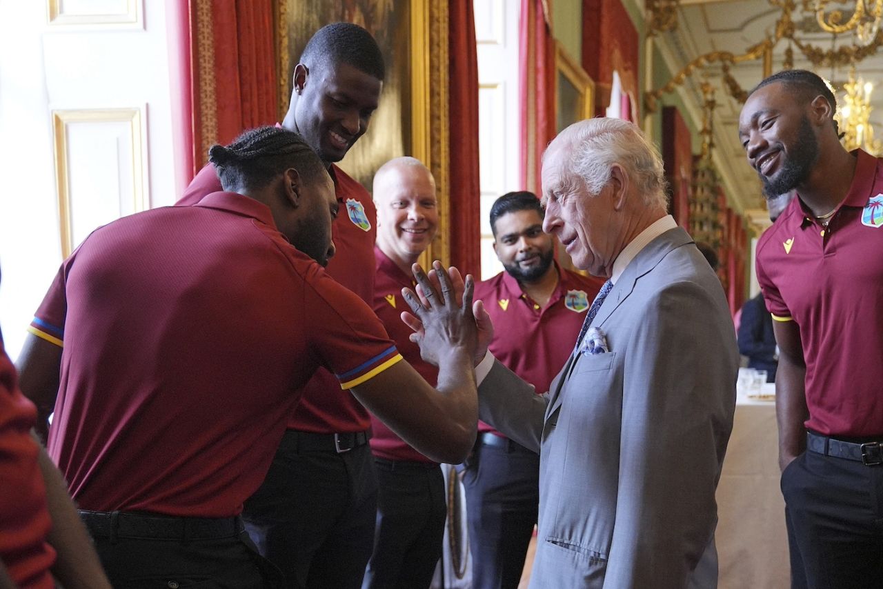 Jeremiah Louis teaches Britain's King Charles his way of shaking hands ...