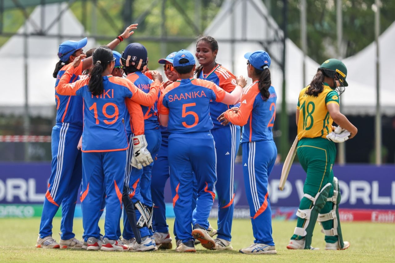 The Indian team gets around Shabnam Shakil after the wicket of Jemma ...