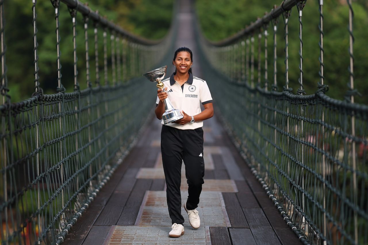 India captain Niki Prasad strikes a pose with the World Cup trophy ...