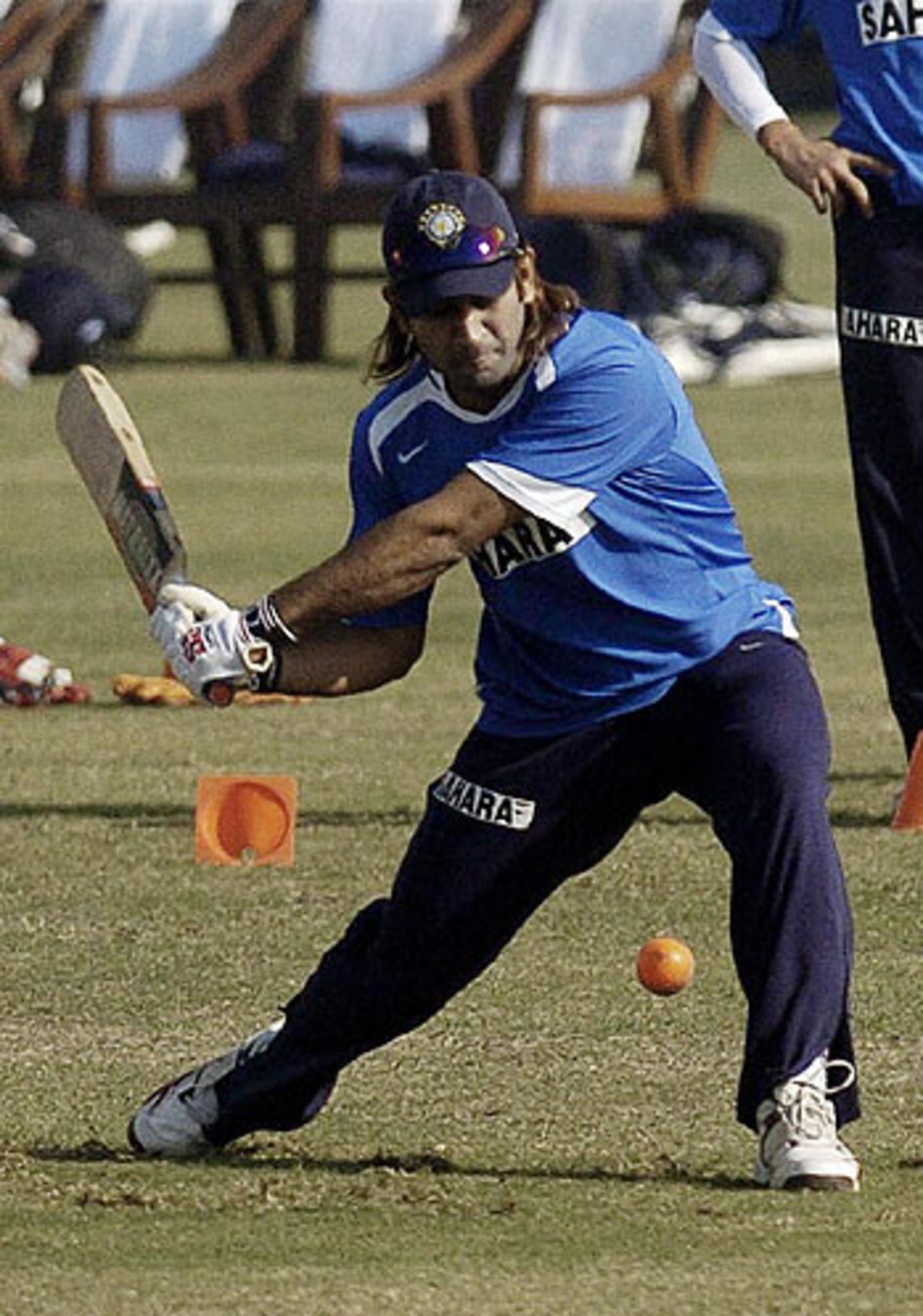 Mahendra Singh Dhoni warms up at the Iqbal Stadium, Faisalabad, January ...
