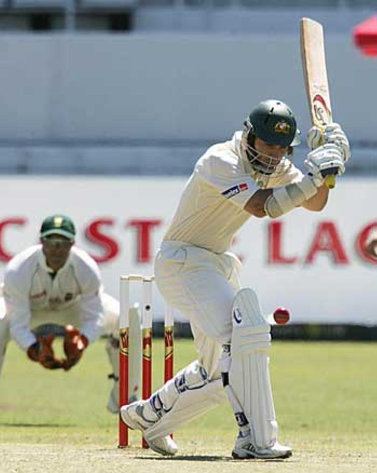 Determination from Justin Langer who refuses to play a wide delivery ...