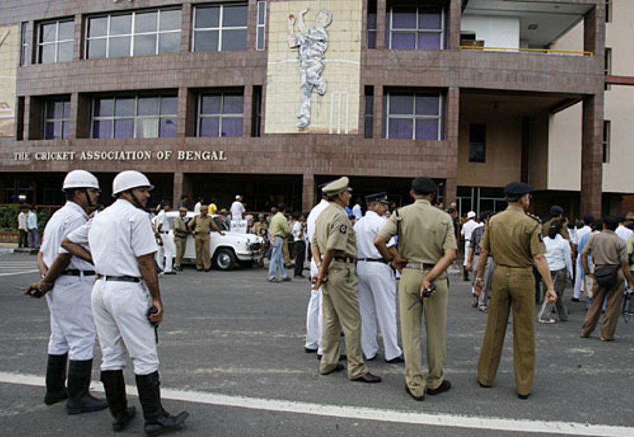 Indian police personnel stand outside the club house of The Cricket ...