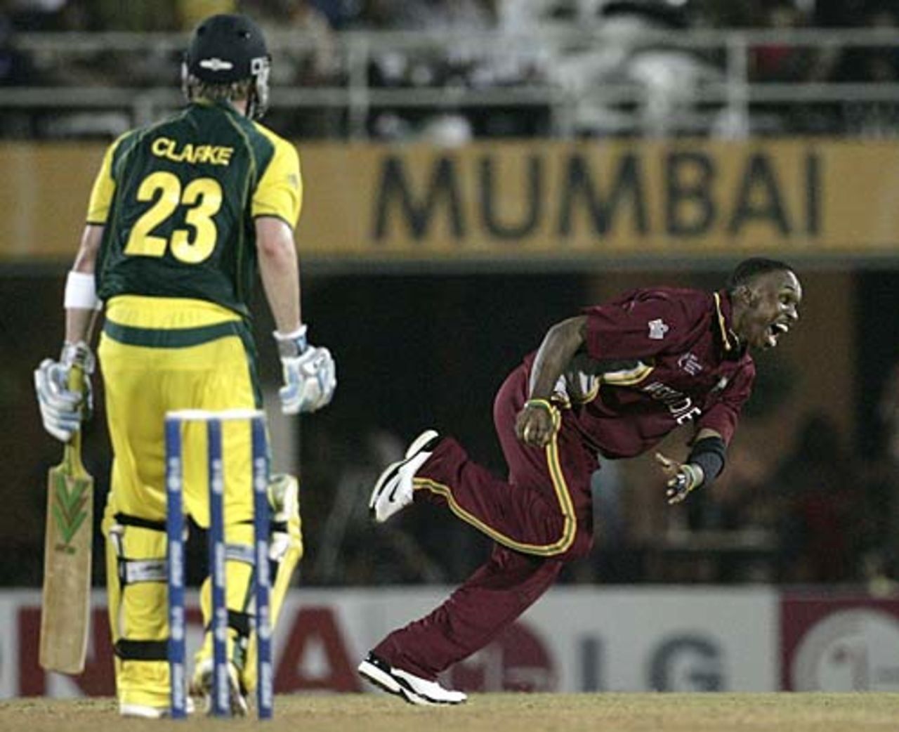 Dwayne Bravo stoops to catch Michael Clarke off his own bowling ...