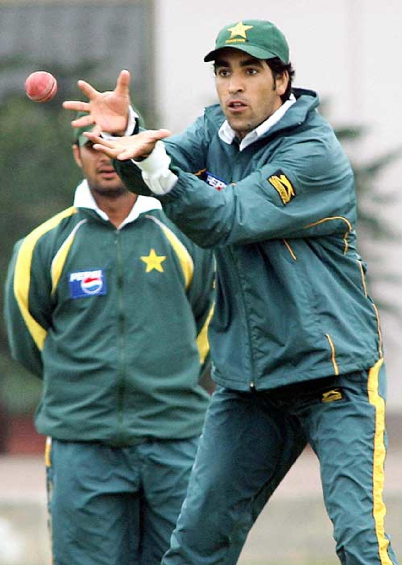 The hero of the first Test, Umar Gul, takes catches during training ...