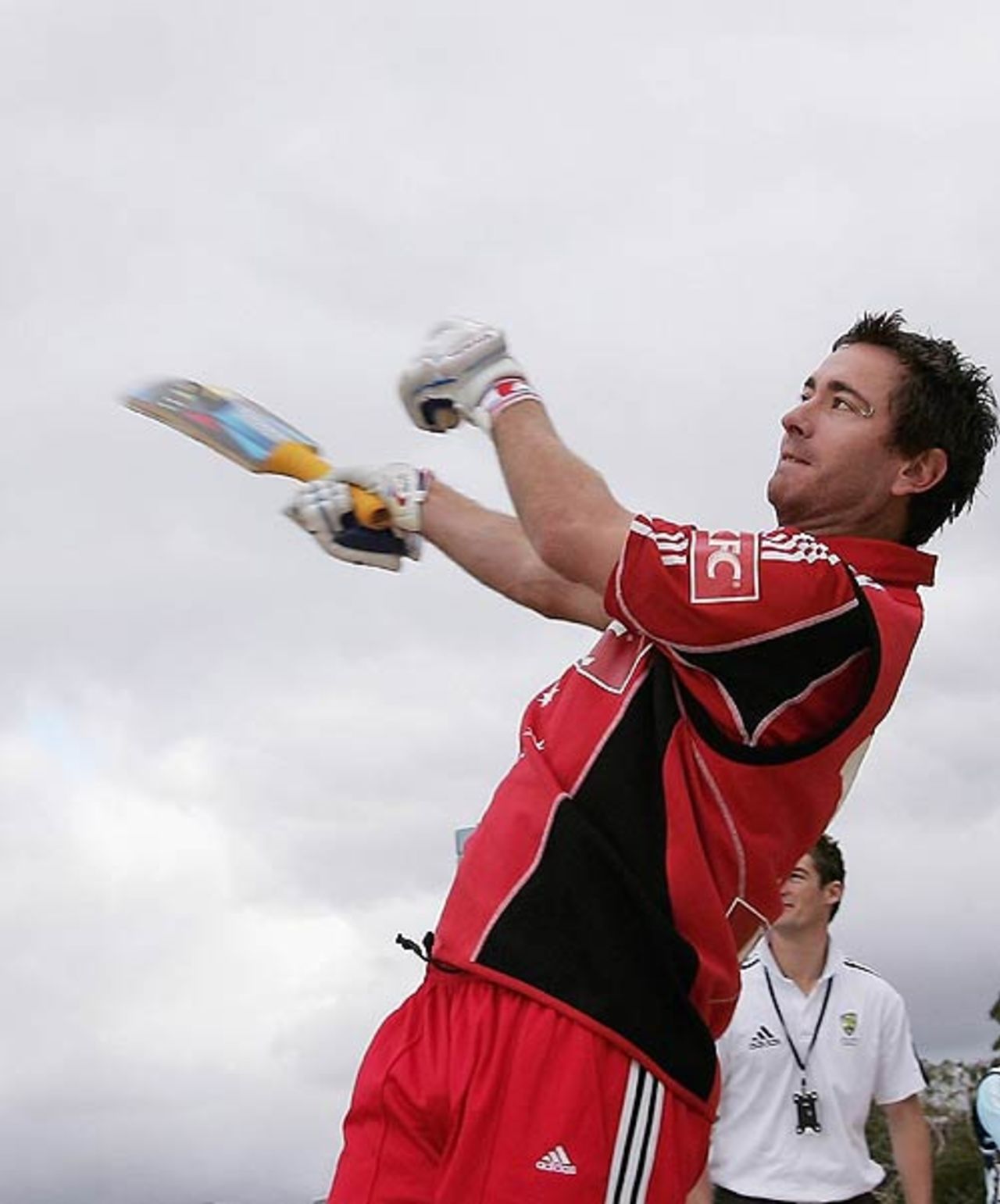 Mark Cleary tries to smash a ball across the Yarra River at the launch ...