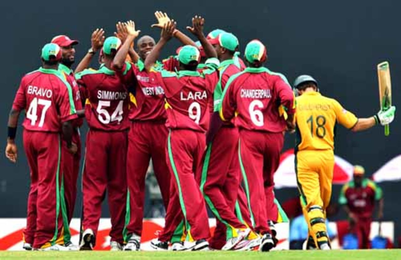 Daren Powell is mobbed by his team-mates after inducing an edge off ...