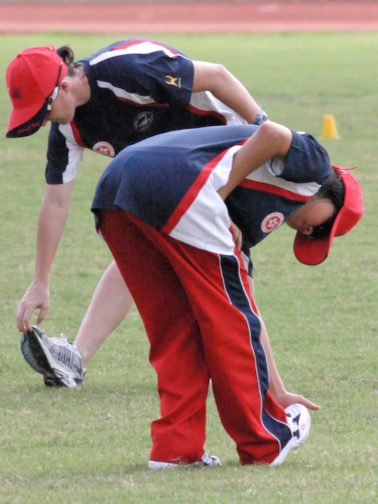Hong Kong's Neisha Pratt and Chan Sau Har stretch before the start of ...