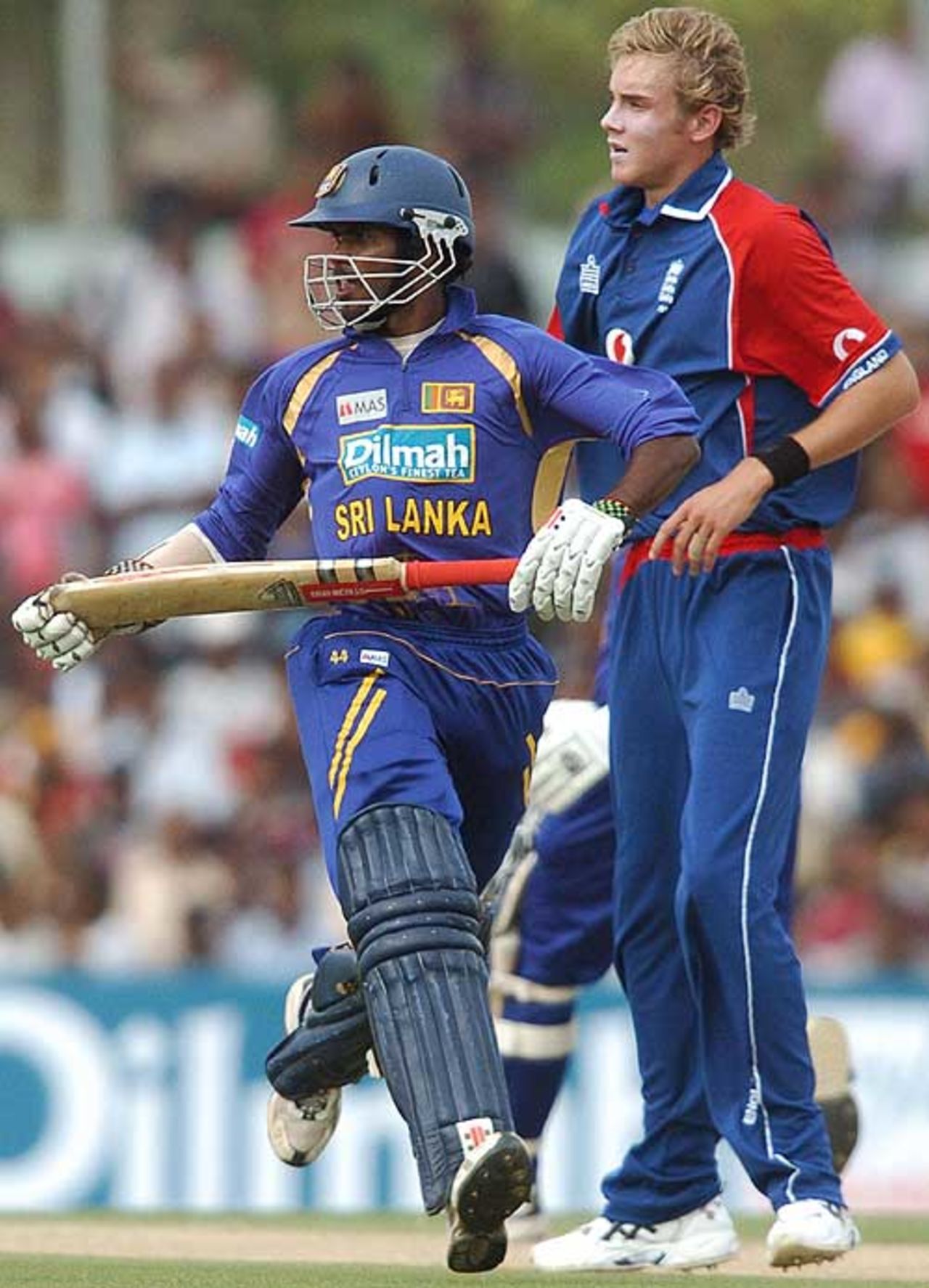 Sanath Jayasuriya runs between the wickets as James Anderson looks on ...