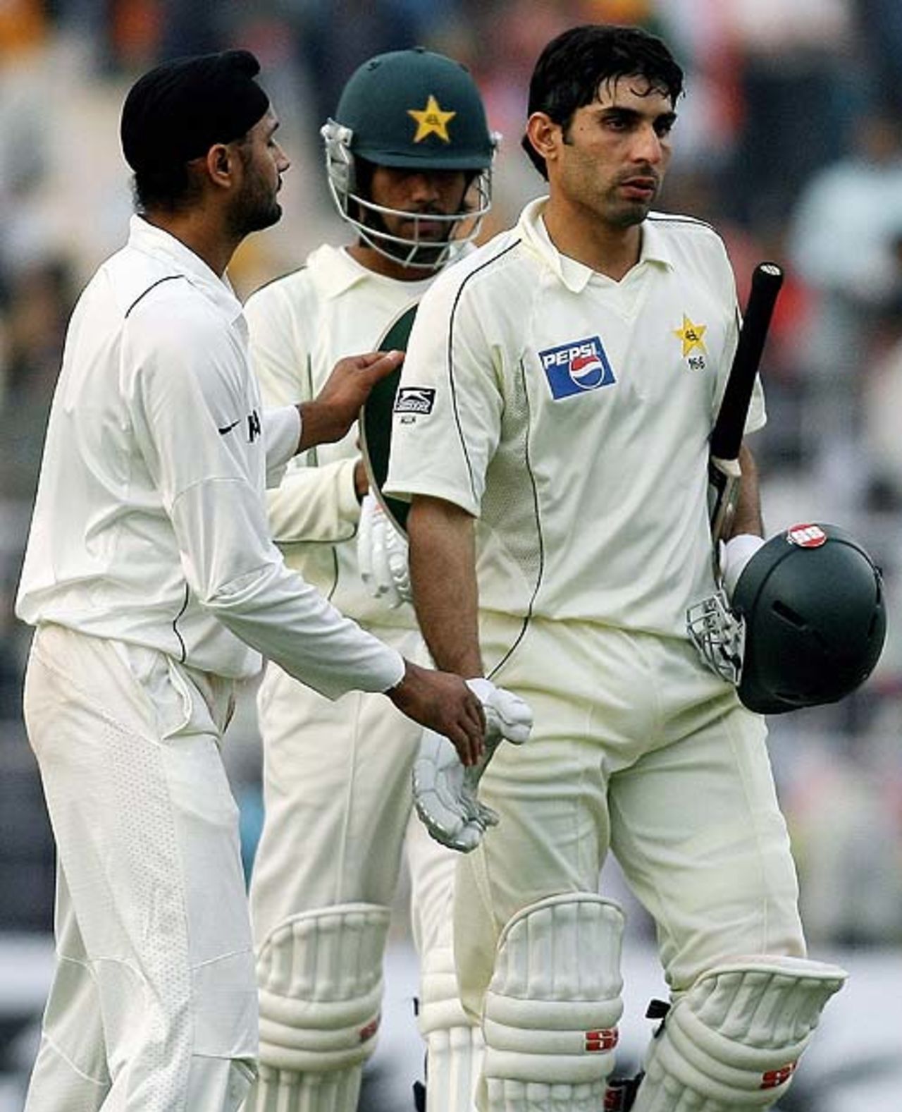 A Collage Of Misbah Ul Haq And Kamran Akmal Playing The Pull