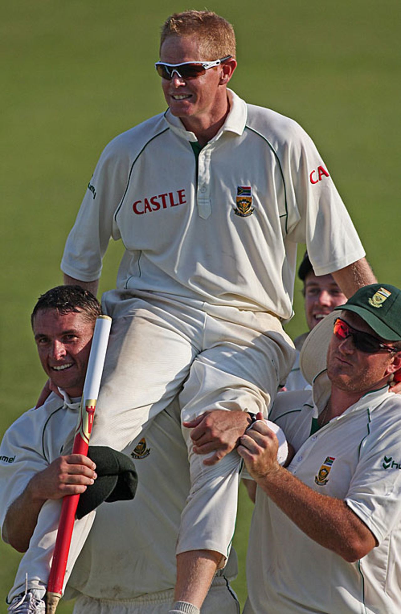 Shaun Pollock is lofted onto Andre Nel and Graeme Smith's shoulders in ...