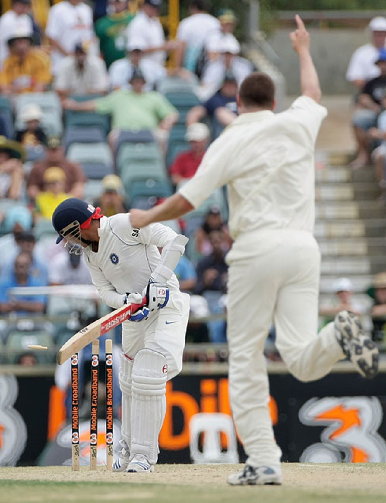 Stuart Clark gets the high-fives after dismissing Virender Sehwag ...