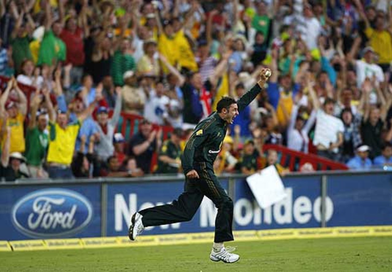 Michael Hussey is mobbed after his stellar boundary catch ...
