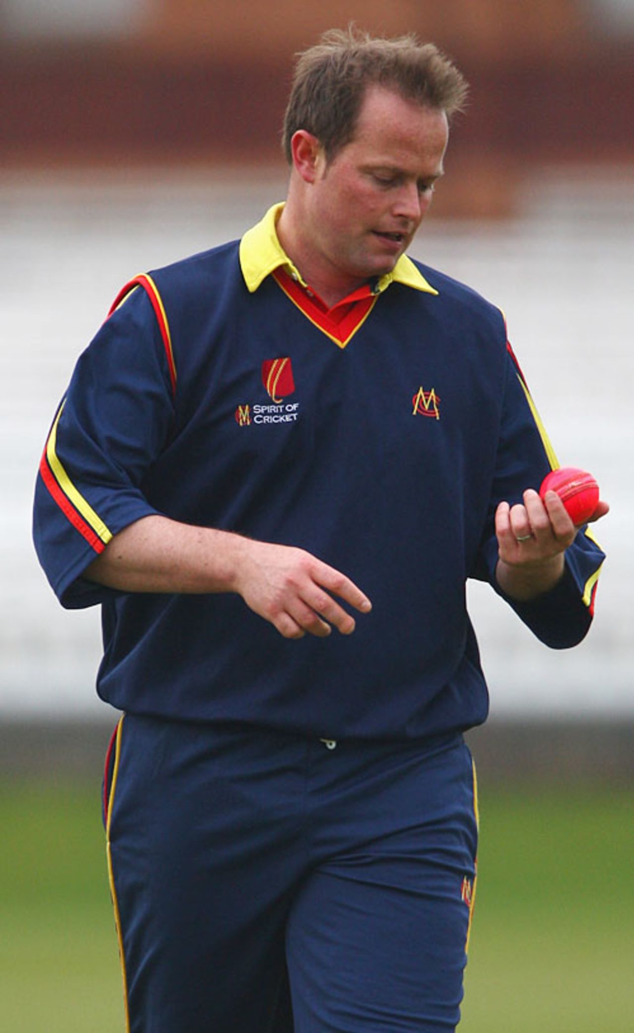 MCC's James Hamblin examines the pink ball during its trial at Lord's ...