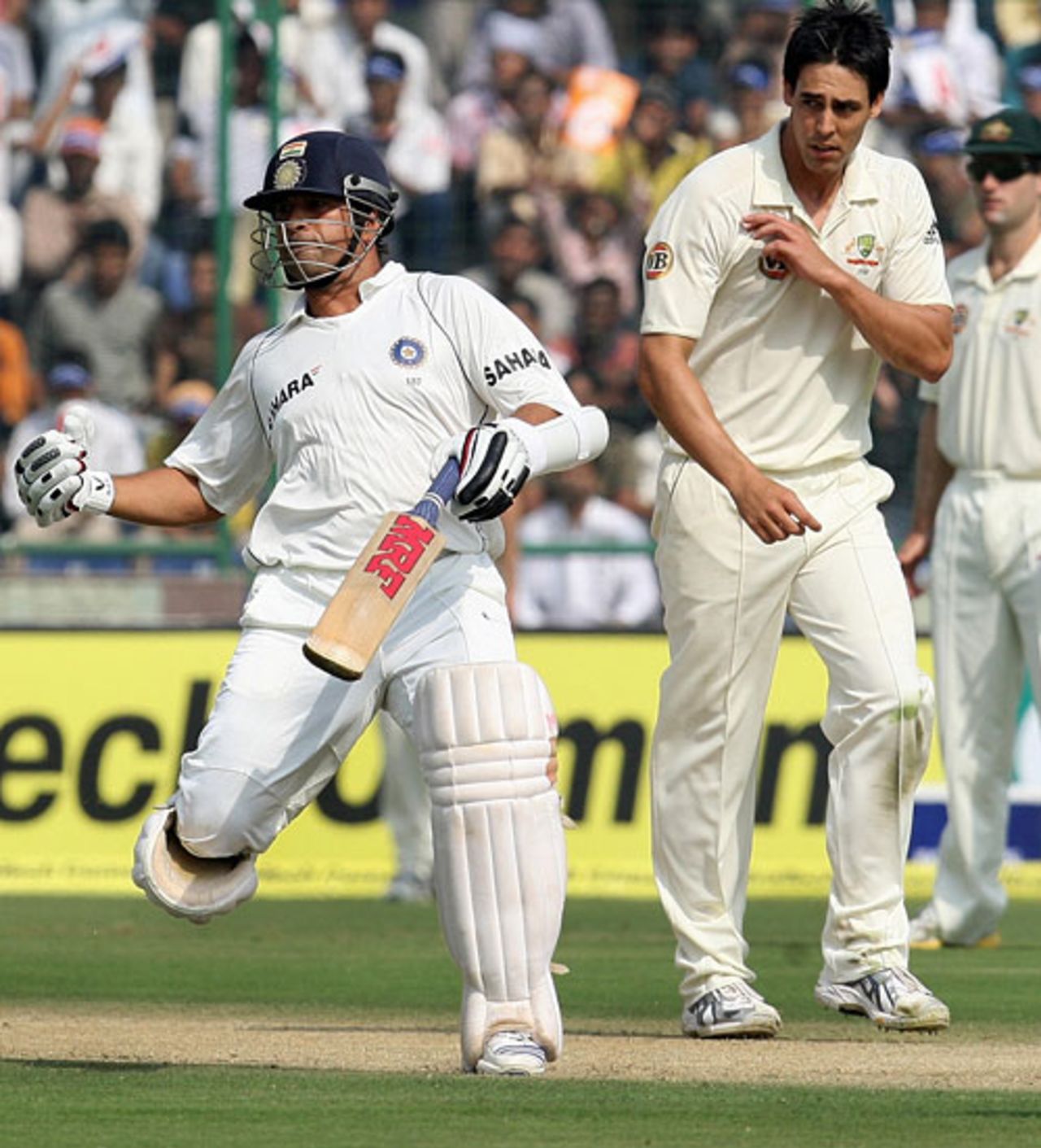 Sachin Tendulkar takes a run as Mitchell Johnson looks on | ESPNcricinfo.com