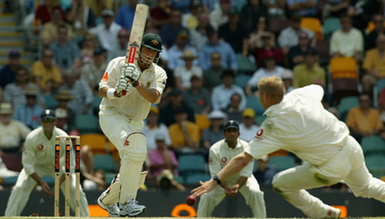 Matthew Hayden drives the ball past Matthew Hoggard during his century ...