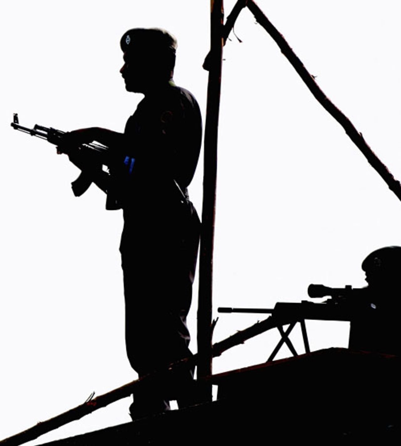 A security guard stands vigil atop a high vantage point at Chepauk ...